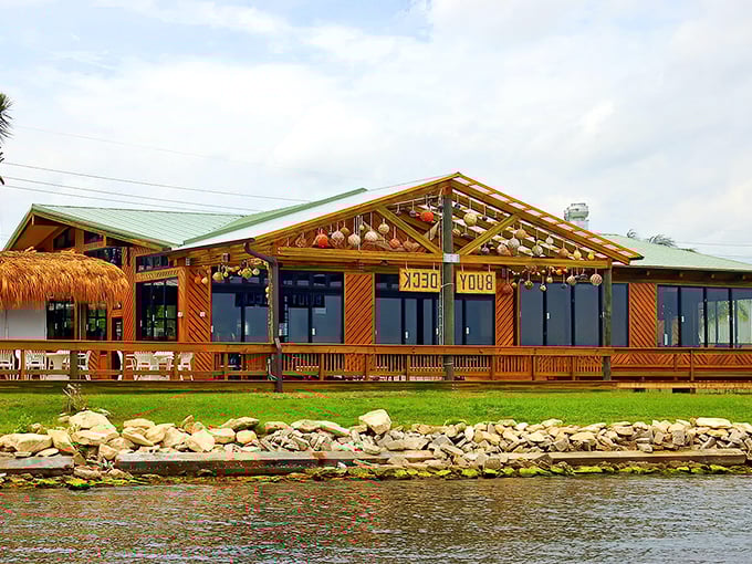 Grills Riverside's thatched-roof tiki paradise sits perfectly perched along the Indian River Lagoon, where seafood dreams meet waterfront reality.