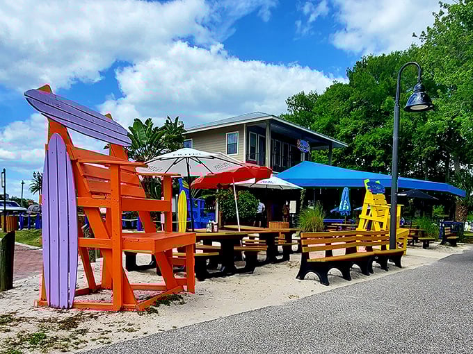 Those oversized Adirondack chairs aren't just for show – they're perfect for post-fish-and-chips relaxation while watching seaplanes land on Lake Dora.
