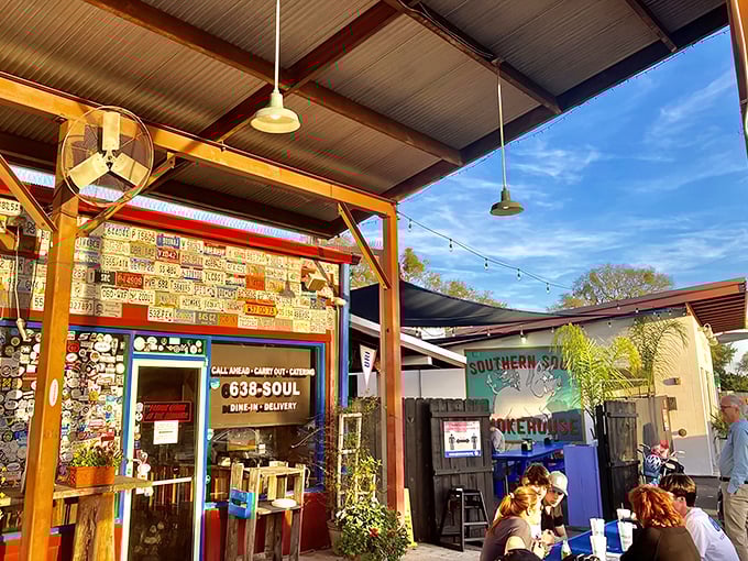 The holy grail of Georgia barbecue beckons with its colorful exterior, where license plates and string lights promise smoky treasures within.