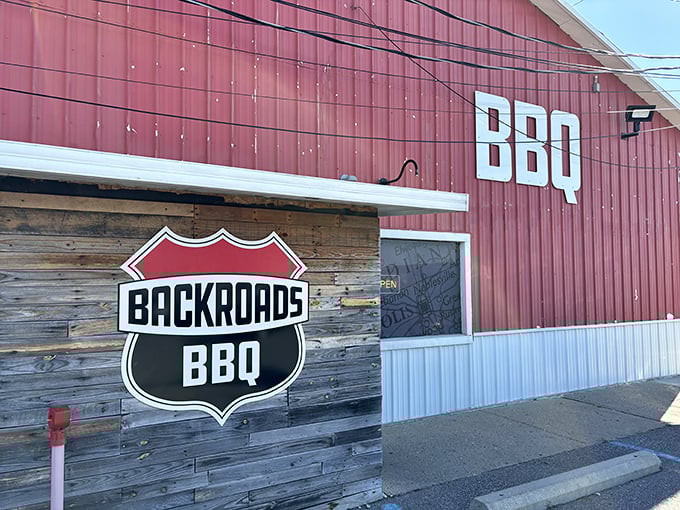 The bright red barn exterior isn't hiding horses – it's housing some of Indiana's most mouthwatering smoked meats. BBQ paradise found!
