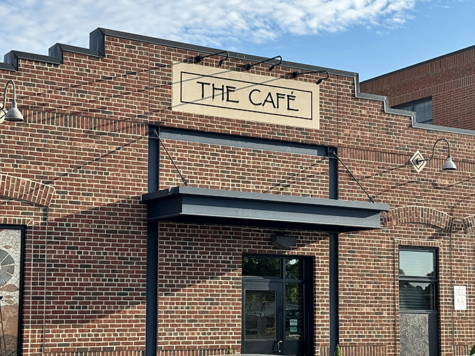The unassuming brick exterior of The Café speaks volumes – greatness doesn't need neon signs or flashy gimmicks, just consistently excellent food.