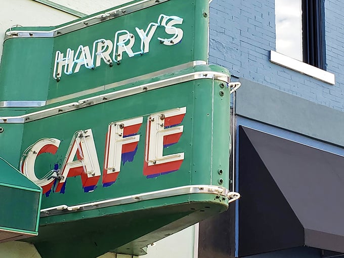 The iconic green sign of Harry's Café stands as a beacon of burger perfection in downtown Pittsburg, promising culinary treasures that locals have treasured for generations.