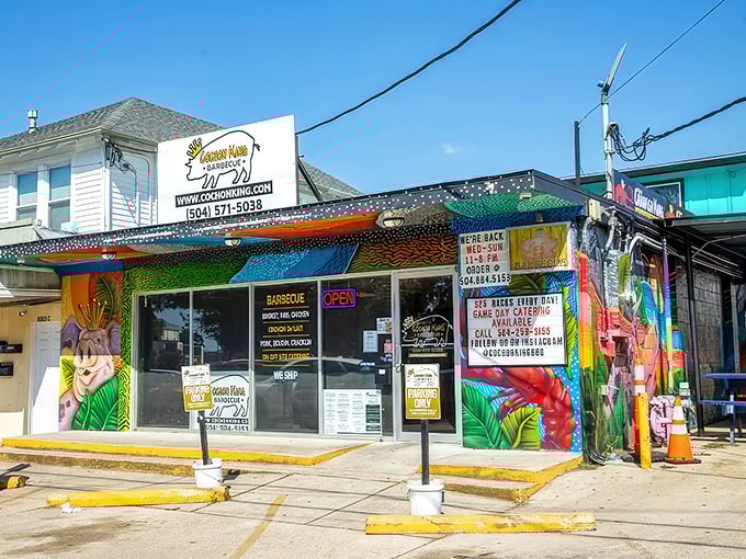 By day, this vibrant BBQ joint stands out with its tropical-inspired murals and bold signage – subtlety isn't on the menu here.