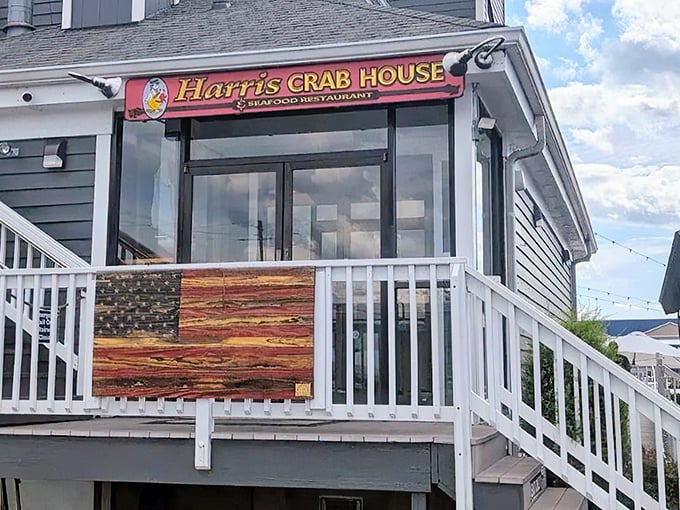 The unassuming exterior of Harris Crab House beckons seafood lovers like a lighthouse calls to ships—promising delicious treasures within those gray-sided walls.