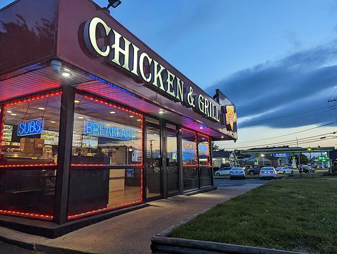 The neon-lit exterior of Legends Chicken & Waffles glows like a beacon for hungry travelers. Those red-trimmed windows practically whisper, "Yes, the chicken really is that good."