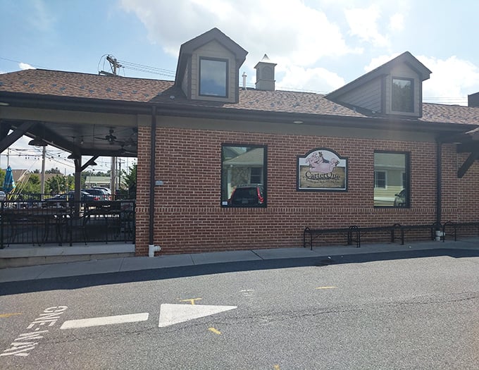 Brick exterior with a covered patio that whispers, "Stay awhile." In barbecue terms, this is what architects call "appetite-inducing design."