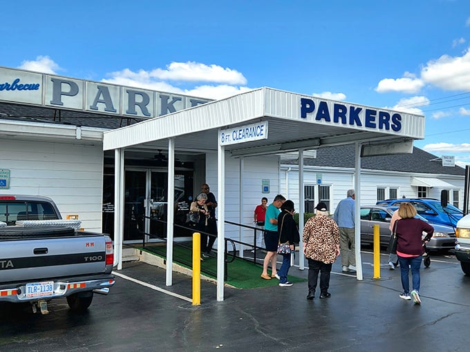 The iconic white exterior of Parker's Barbecue stands like a beacon for hungry travelers. That "8 FT CLEARANCE" sign isn't just a warning—it's a promise of headroom for big appetites.