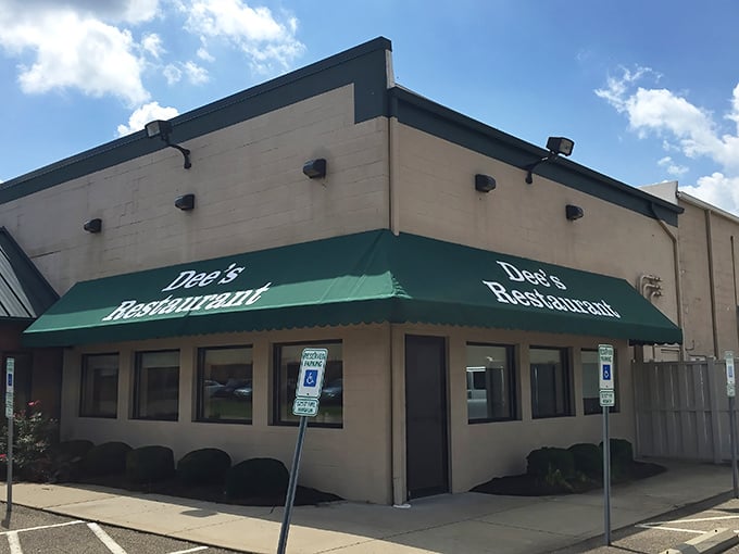 The unassuming exterior of Dee's Restaurant with its signature green awning stands as a beacon for breakfast pilgrims across Ohio. No fancy frills, just the promise of morning magic inside.