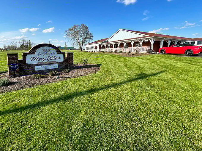 That green lawn and welcoming sign announce you've arrived somewhere special, where buggies meet bumpers in peaceful coexistence.