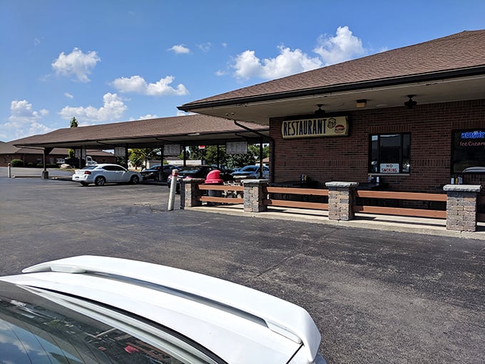 The classic brick exterior of B & K Root Beer Stand beckons with its covered parking spots—a time machine disguised as a restaurant in Troy, Ohio.