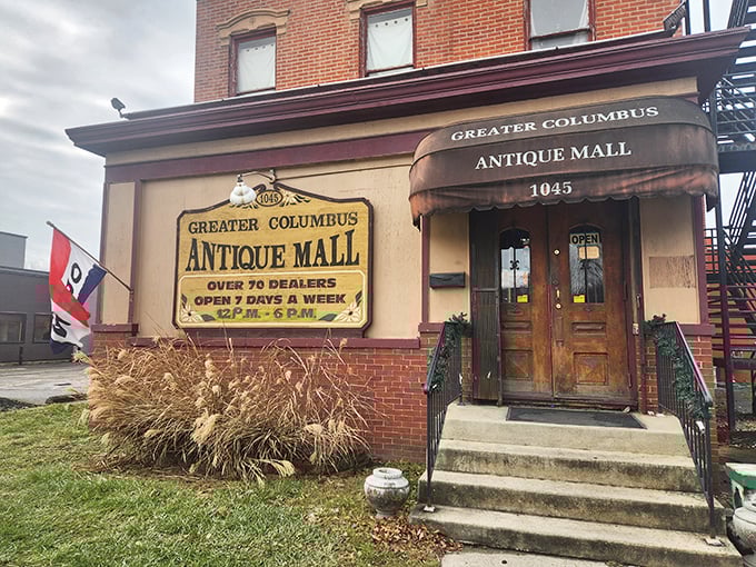 The brick façade of Greater Columbus Antique Mall stands like a time portal, its vintage sign promising treasure hunters over 70 dealers and daily adventures from noon to 6pm. 