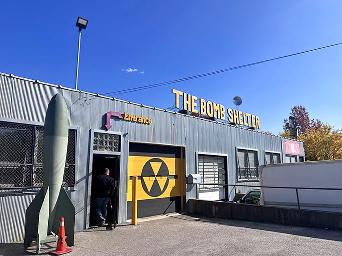 The exterior screams "Cold War chic" with its corrugated metal facade, nuclear symbol, and yes—that's an actual missile prop greeting visitors.