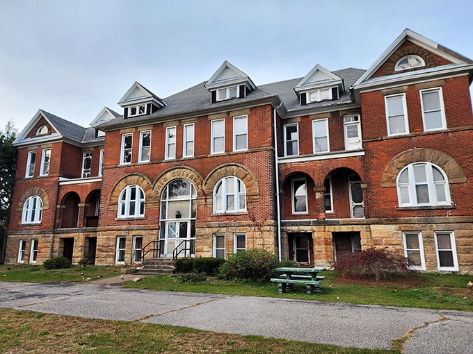 The imposing facade of Madison Seminary stands as a brick-and-mortar time capsule, its windows seemingly watching your every move as you approach.