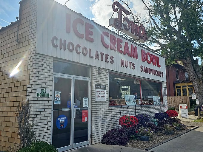 The unassuming white brick façade of Tom's Ice Cream Bowl stands as a beacon to ice cream pilgrims. This isn't architecture—it's a promise of deliciousness inside.