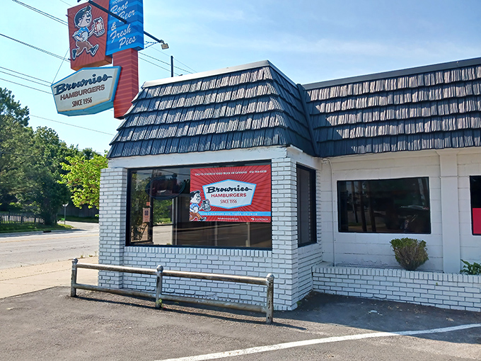 That vintage cartoon character on the sign isn't just cute nostalgia—he's promising you the meal that might just ruin all other burgers forever.