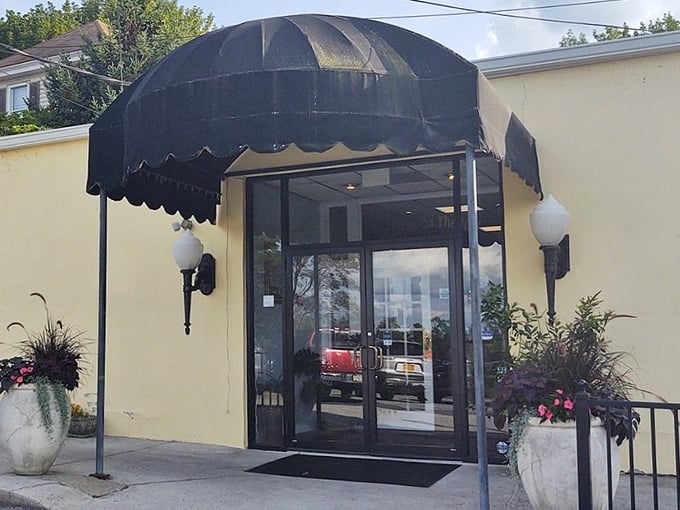The unassuming cream exterior with its elegant black awning is like a secret handshake – those who know, know. This isn't flashy; it's focused on what matters inside.
