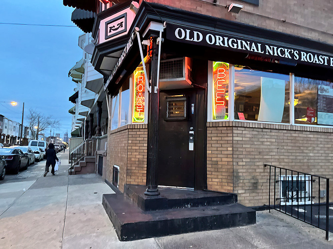The corner beacon of beefy bliss! Nick's modest brick exterior with neon signs promises more flavor than flash—Philadelphia's culinary truth in advertising.