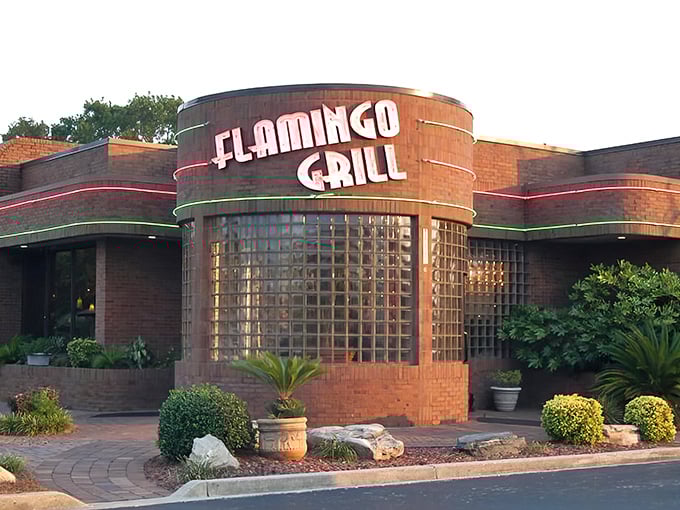 The Art Deco curves and glass block windows of Flamingo Grill aren't just eye candy—they're a promise that what awaits inside transcends typical beach town dining.