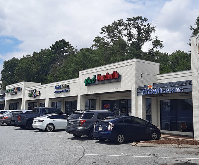 That playful green and red signage beckoning you from the strip mall is your first hint that flavor awaits inside.
