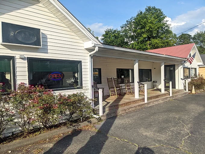 The unassuming exterior of Olde House Café, complete with rocking chairs on the porch, promises Southern comfort without the frills.