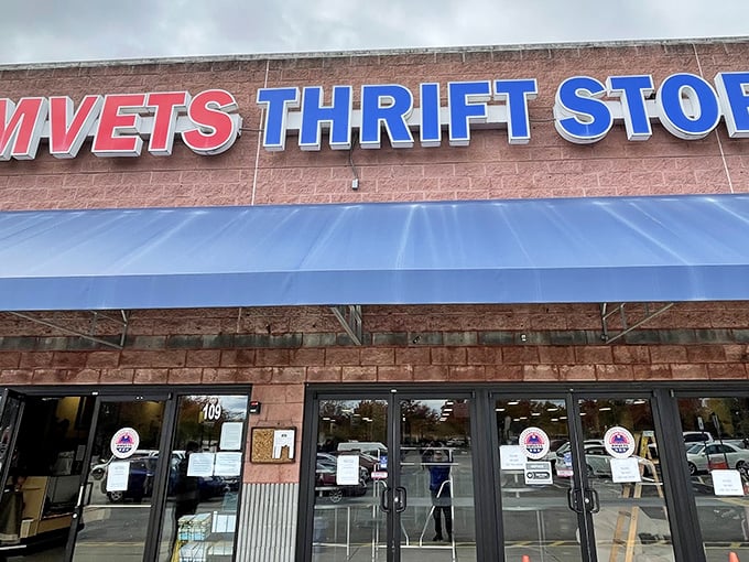 The iconic red and blue AMVETS sign beckons like a siren song to bargain hunters. Your wallet is already breathing a sigh of relief.