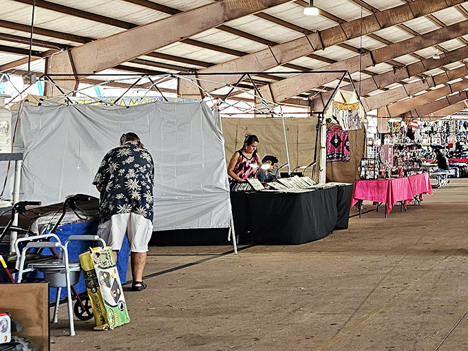 The early bird gets the bargain! Vendors setting up their stalls under the vast covered pavilions where treasure hunting begins at dawn.