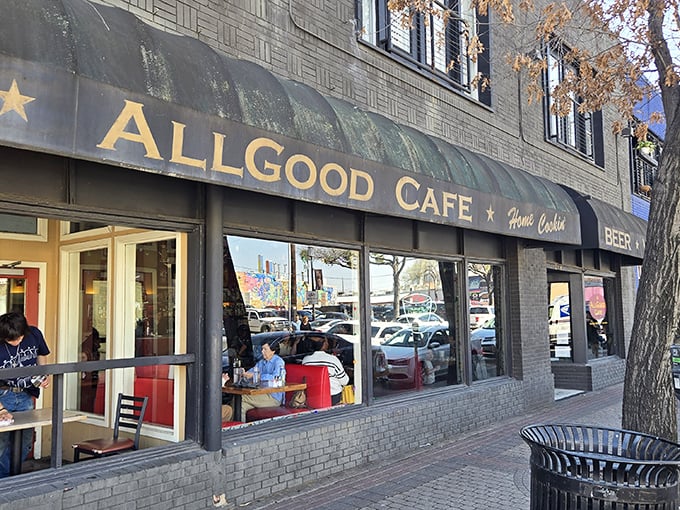 A classic black awning with gold lettering – like a humble Broadway marquee announcing the daily show of comfort food and community that unfolds inside.