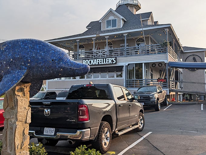 The coastal charm of Rockafeller's exterior beckons with its wraparound deck and American flag fluttering above—a siren call to seafood lovers everywhere.