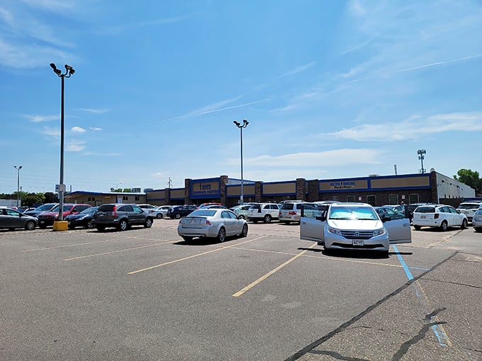 The parking lot tells a story: Wisconsin license plates from counties near and far, all gathered for the thrill of the hunt.
