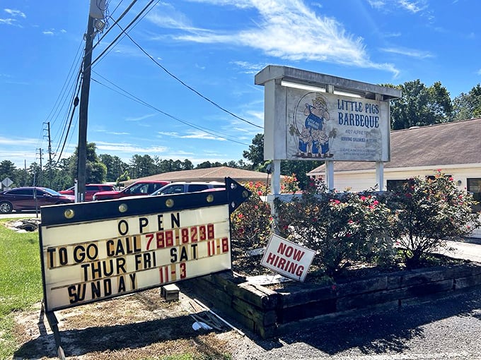 The unassuming roadside sign says it all – this isn't about fancy frills, it's about serious barbecue that keeps locals coming back for decades.