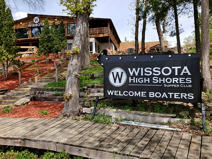 The "Welcome Boaters" sign says it all—this lakeside gem combines rustic Wisconsin charm with an invitation to arrive by water or road.