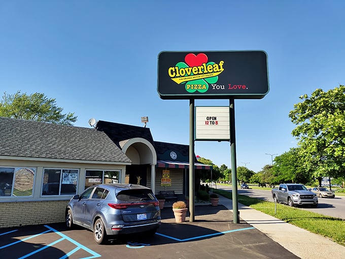 That sign isn't just promising pizza—it's announcing a Michigan institution where dough dreams come true.