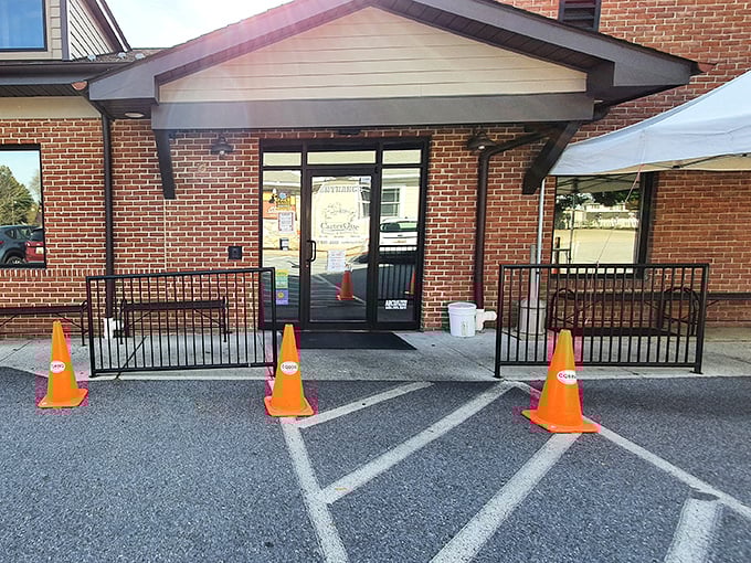 The unassuming entrance to barbecue paradise. Those orange cones aren't directing traffic—they're guiding hungry souls to smoked meat nirvana.