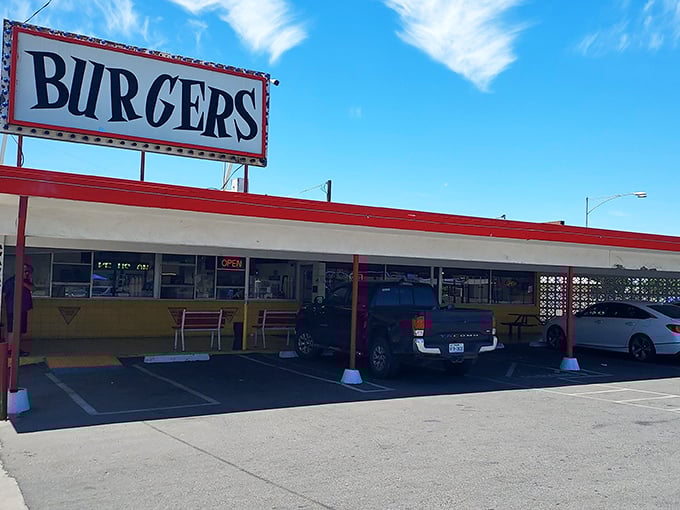 That iconic "BURGERS" sign against the California sky isn't just advertising—it's a beacon of hope for the hungry and a promise of deliciousness to come.