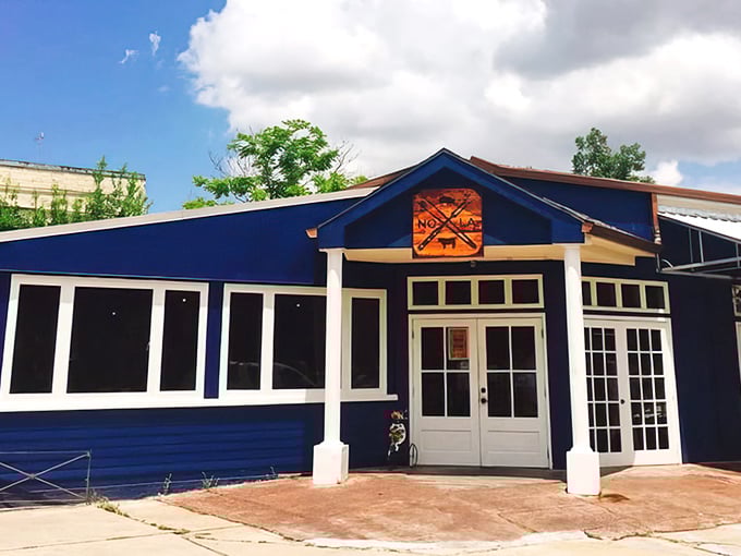 The blue exterior of Blue Oak BBQ stands out like a beacon of smoky hope in Mid-City New Orleans, promising meaty treasures within.