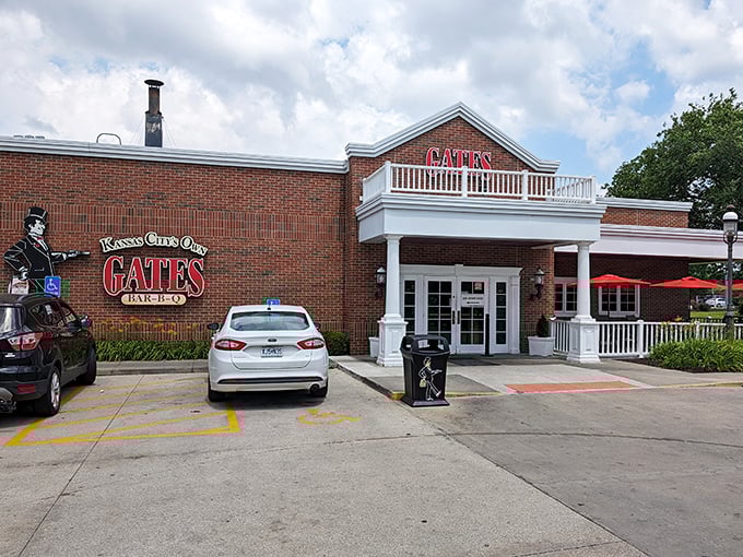 The brick façade and white columns of Gates Bar-B-Q stand like a barbecue embassy in Kansas City, promising smoky diplomacy and sauce-stained satisfaction to all who enter.