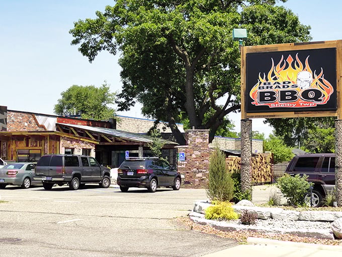Flames painted on the roadside sign aren’t just decoration—they’re a warning. Your taste buds are about to experience a delicious inferno of Michigan barbecue magic.