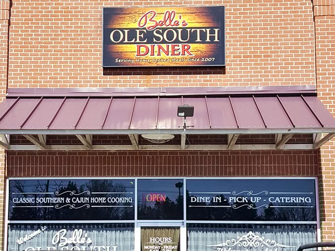 The brick facade and illuminated sign of Belle's Ole South Diner stand as a beacon for breakfast enthusiasts across Louisiana. Southern comfort food has found its home.