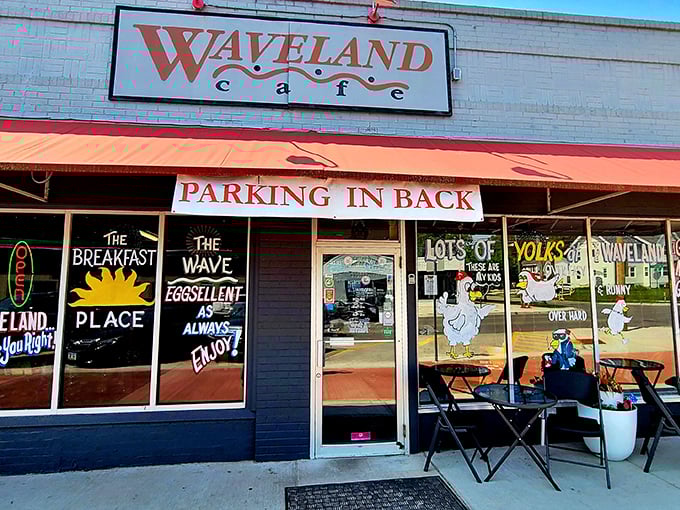 The iconic Waveland Café storefront beckons with its cheerful red awning and whimsical window art. "The Breakfast Place" indeed—truer words were never painted on glass.