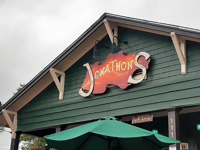 That iconic orange sign against the green siding is like a Texas sunrise – a promise that something warm and wonderful awaits inside.