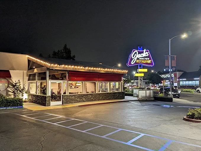 The neon glow of Jack's iconic sign beckons hungry travelers like a lighthouse for comfort food enthusiasts. Classic Americana at its finest.