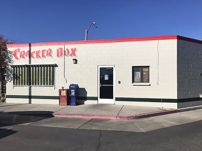 The unassuming exterior of The Cracker Box stands like a culinary sentinel on the corner, its red-trimmed sign promising breakfast treasures within.