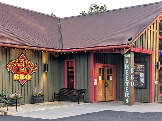 The welcoming entrance says it all – no pretension here, just the promise of serious BBQ behind those wooden doors trimmed in cheerful red.