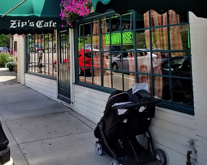 The unassuming storefront of Zip's Cafe, with its classic green awning and neon sign, promises burger bliss without the fanfare. Cincinnati's best-kept secret hides in plain sight.