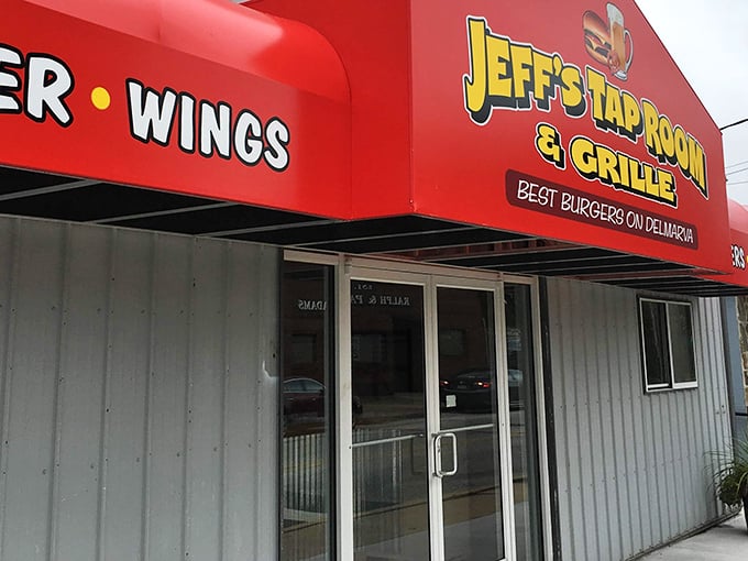 The bright red awning of Jeff's Taproom & Grille stands out like a culinary lighthouse, boldly proclaiming "BEST BURGERS ON DELMARVA" – a promise they deliver on with gusto.
