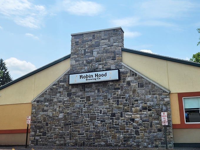The stone facade of Robin Hood Brewing Co. stands like a medieval fortress of flavor, promising liquid gold and culinary treasures within.