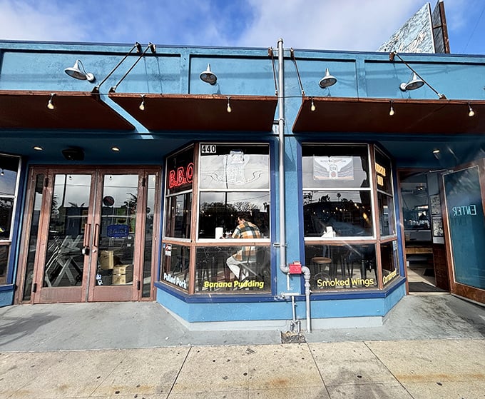 The unassuming blue storefront of Baby Blues BBQ in Venice – where barbecue dreams come true without any fancy pretensions.