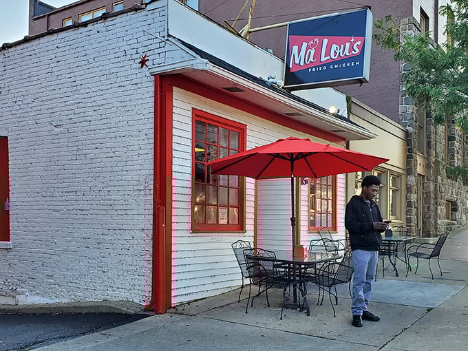 The little white building with bold red trim isn't trying to impress anyone—until you taste what's cooking inside. Culinary magic in disguise.