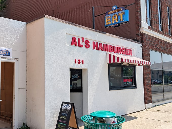 The classic white storefront with that iconic red and white awning – like a beacon of burger hope on Washington Street.