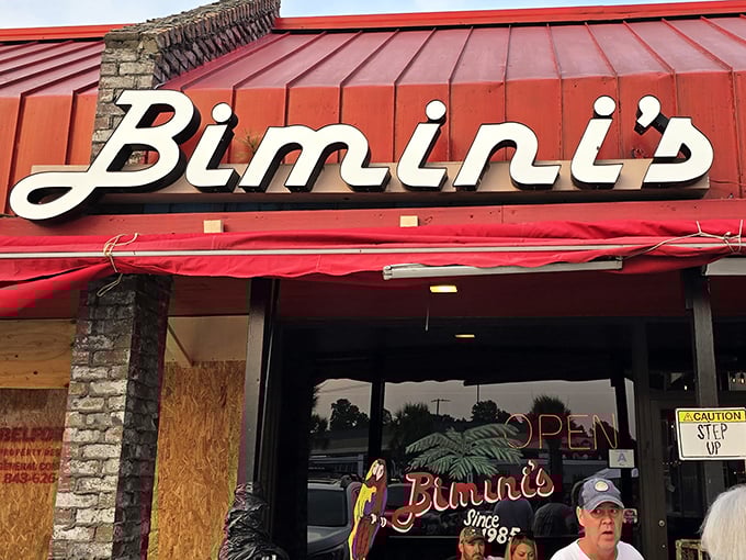 That iconic red roof and cursive sign – like a beacon calling to seafood lovers across Myrtle Beach. No fancy frills, just the promise of oceanic treasures inside.
